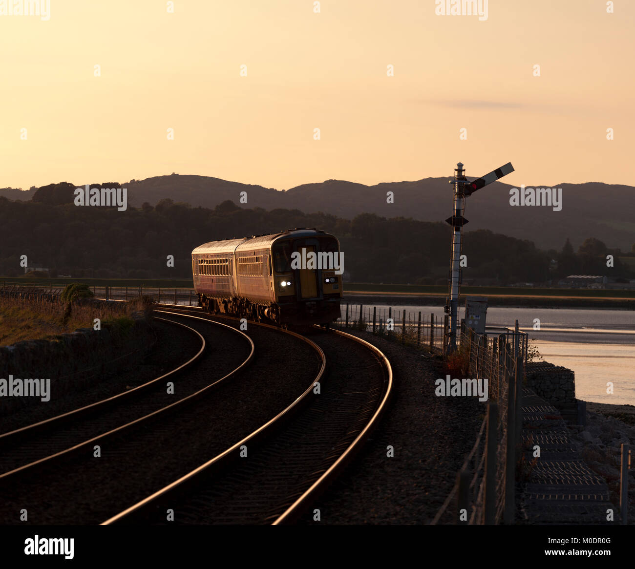 A Northern rail sprinter train runs off Arnside viaduct, Cumbria at ...