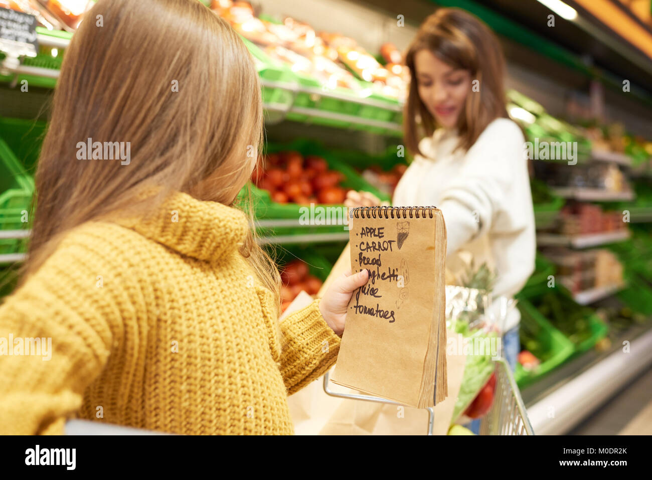 Little Girl Helping Grocery Shopping Stock Photo - Alamy