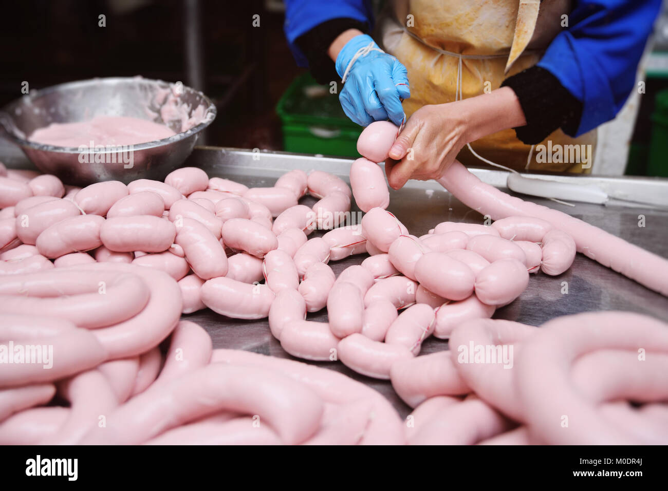 Butchers process meat Stock Photo - Alamy