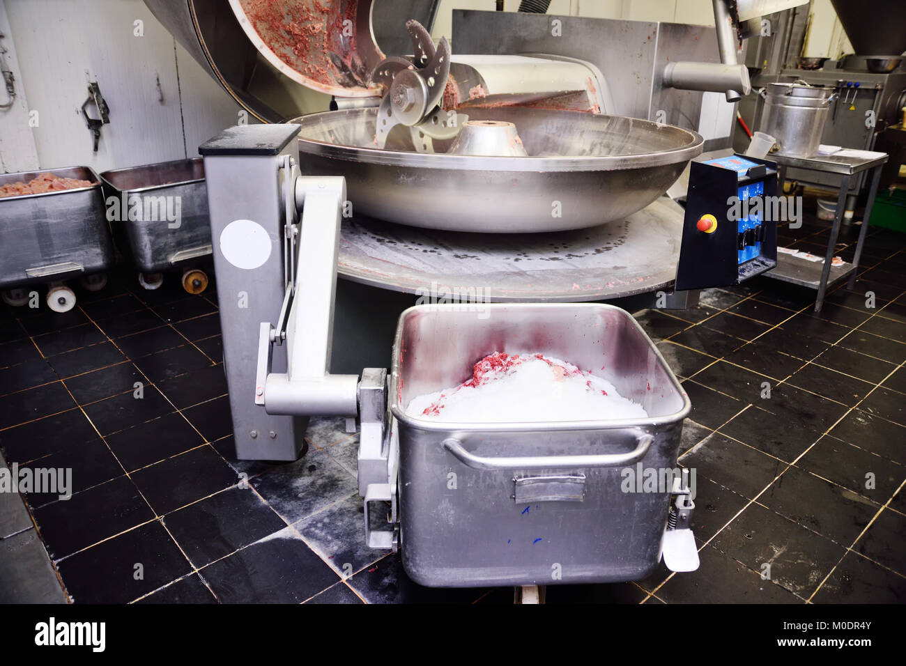 processing of meat in the food industry on a cutter Stock Photo - Alamy