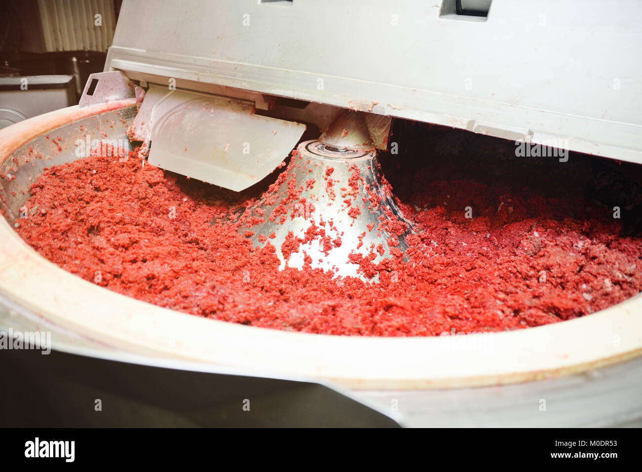 processing of meat in the food industry on a cutter Stock Photo - Alamy