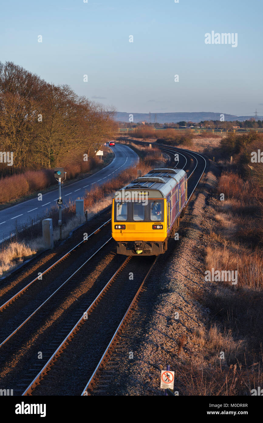 A Northern rail class 142 pacer train passing Teesside Airport 142094 ...