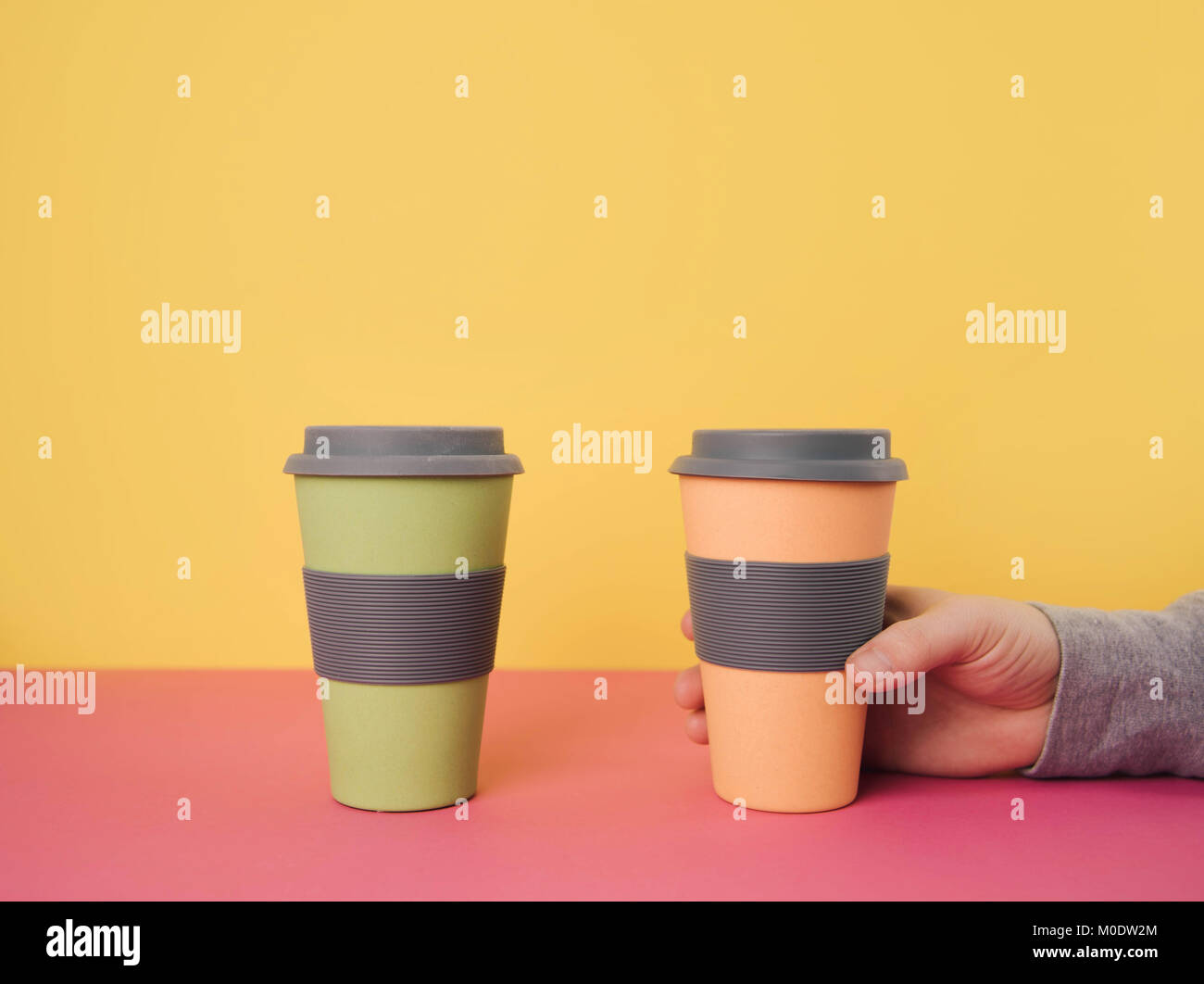 Hand holding take away coffee cup Stock Photo - Alamy
