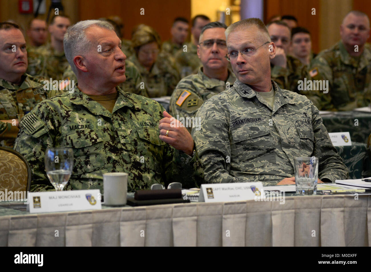 U.S. Navy Chaplain (Capt.) Wayne Macrae, left, Command Chaplain of U.S ...