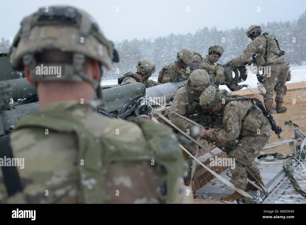 U.S. Army Paratroopers assigned to 4th Battalion, 319th Airborne Field Artillery Regiment, 173rd ...