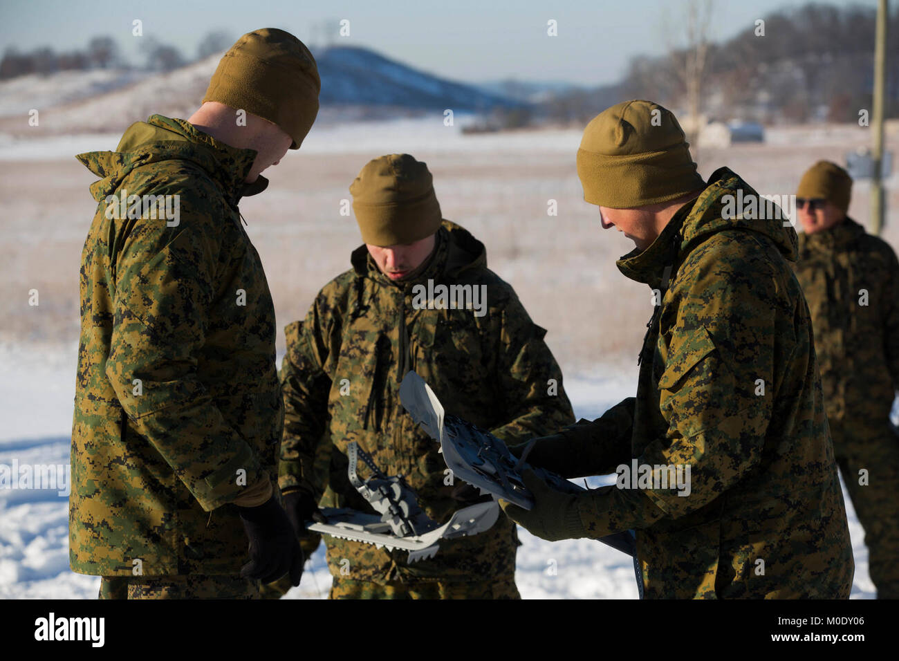 U.S. Marines assigned to Marine Wing Headquarters Squadron 2 help each ...
