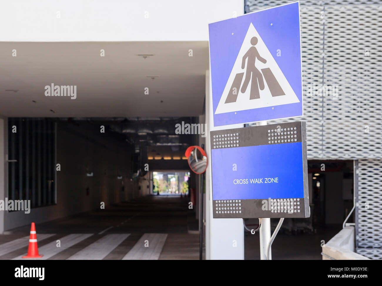crosswalk sign with the building pattern as a background. It look like ...
