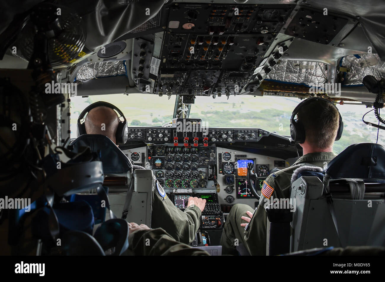 U.S. Air Force Lt. Col. Kevin Alons (left) and 1st Lt. Caleb Degroot ...