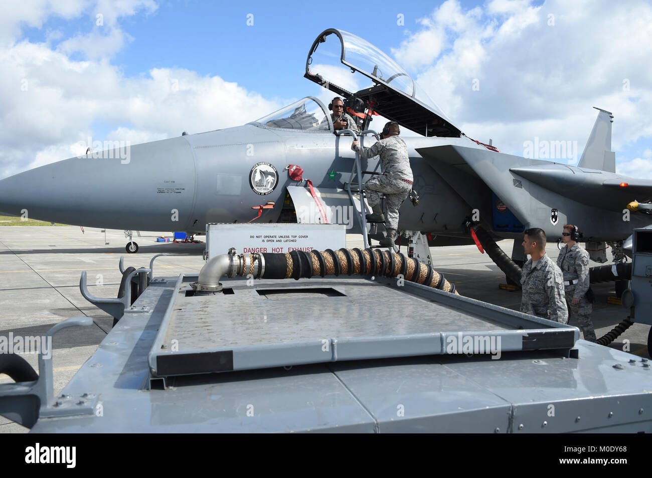 Airmen from the 144th Fighter Wing troubleshoot an issue with an F-15C ...