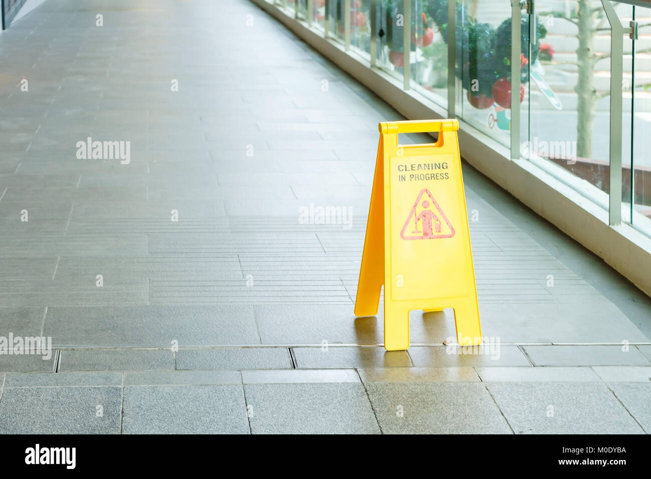 yellow sign inside building hallway, Sign showing warning of caution ...