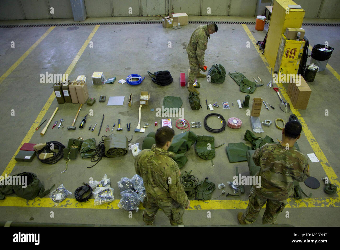 Employees from General Dynamics Land Systems help Soldiers assigned to ...