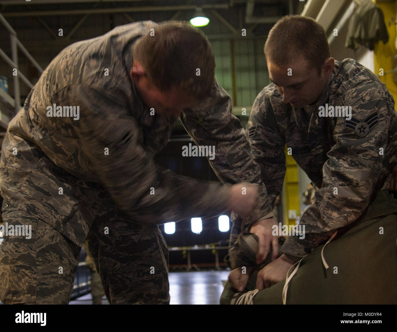 U.S. Air Force Airman 1st Class Zachary Barber (left) and Senior Airman ...