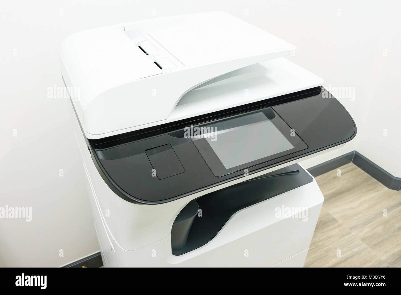 photocopier is a machine that makes paper copies of documents and other ...