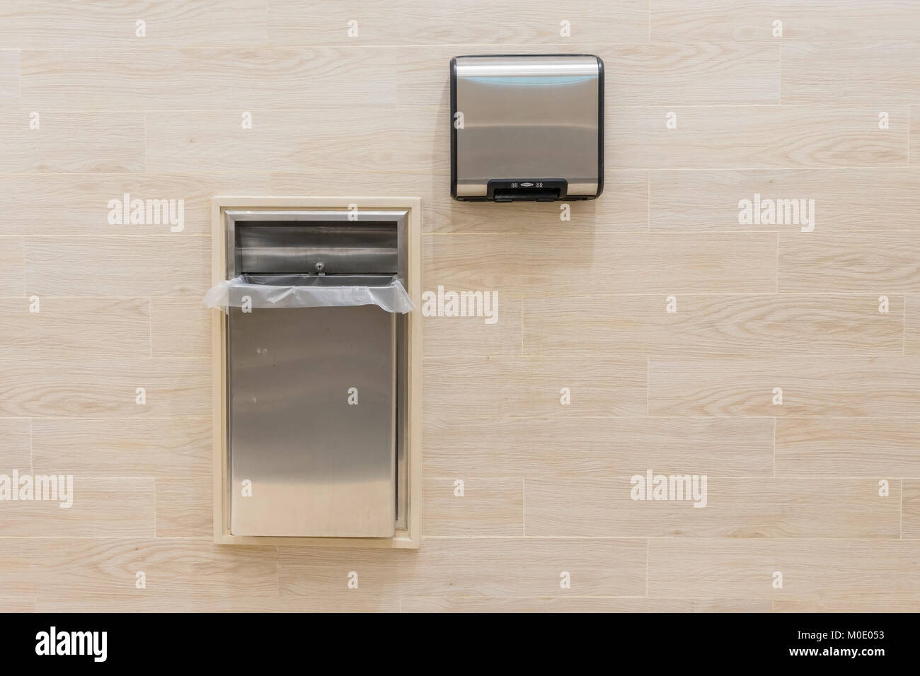 tissue paper and trash bin on wooden wall at public toilet Stock Photo ...