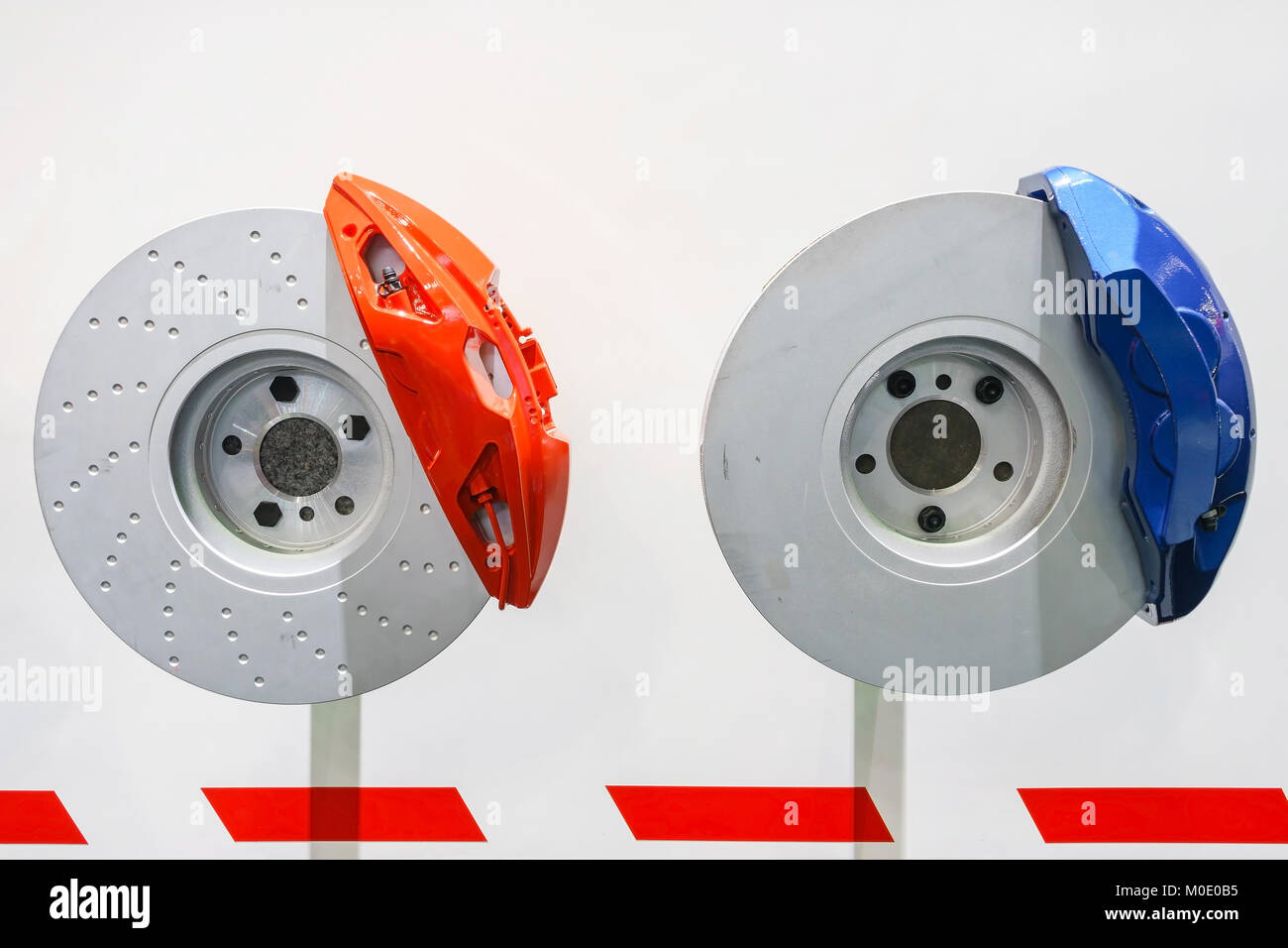 Brake Discs with Red and Blue Callipers from a Racing Car isolated on ...