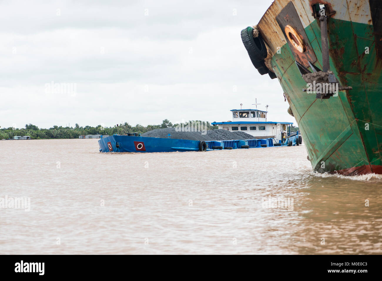 Barge carrying quarry materials, Mekong delta Stock Photo - Alamy