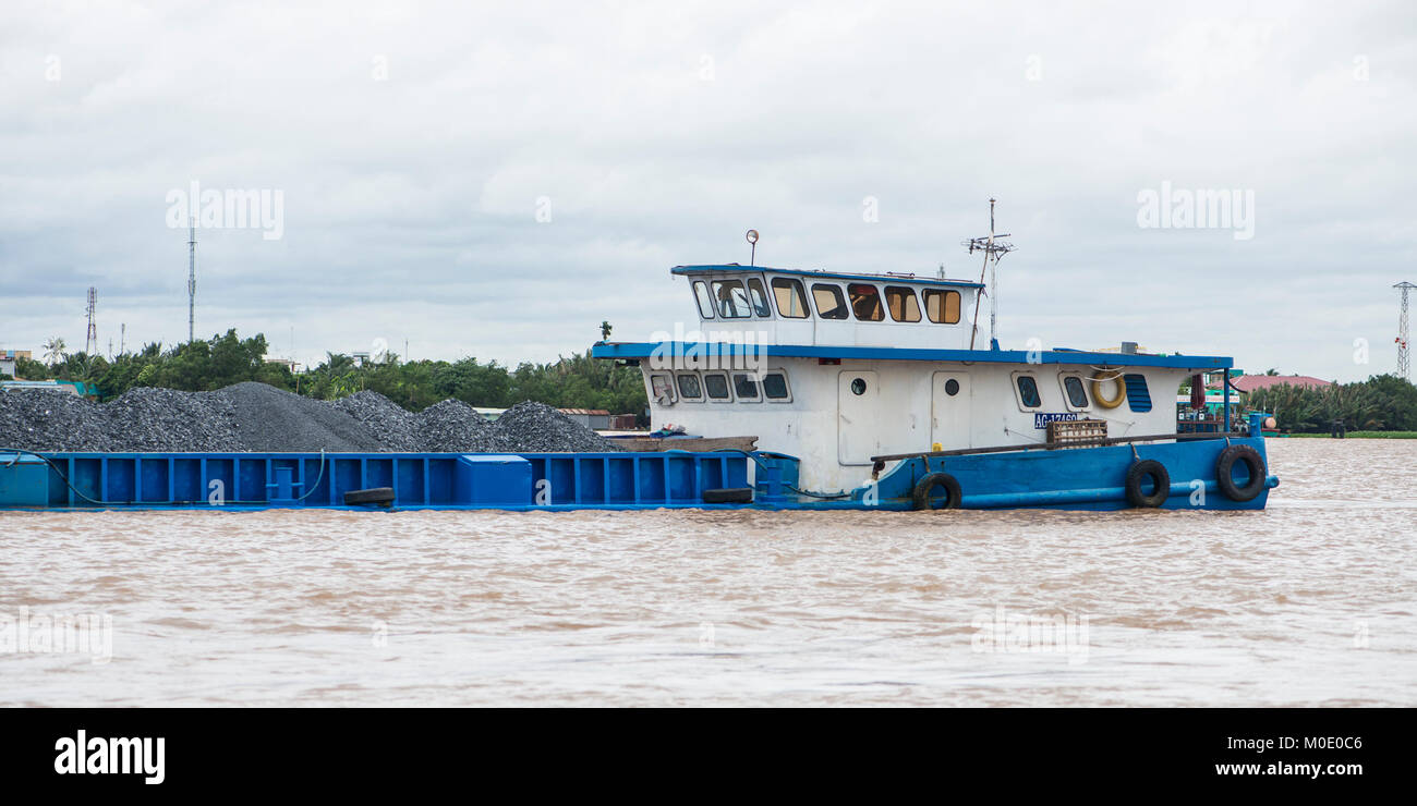 Barge carrying quarry materials, Mekong delta Stock Photo - Alamy