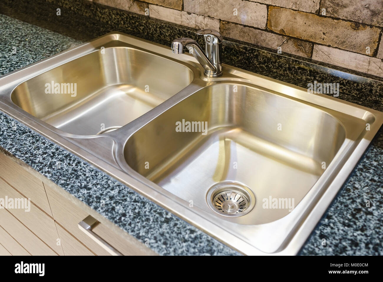 Angle view of kitchen sink with silver faucet in kitchen room, modern ...