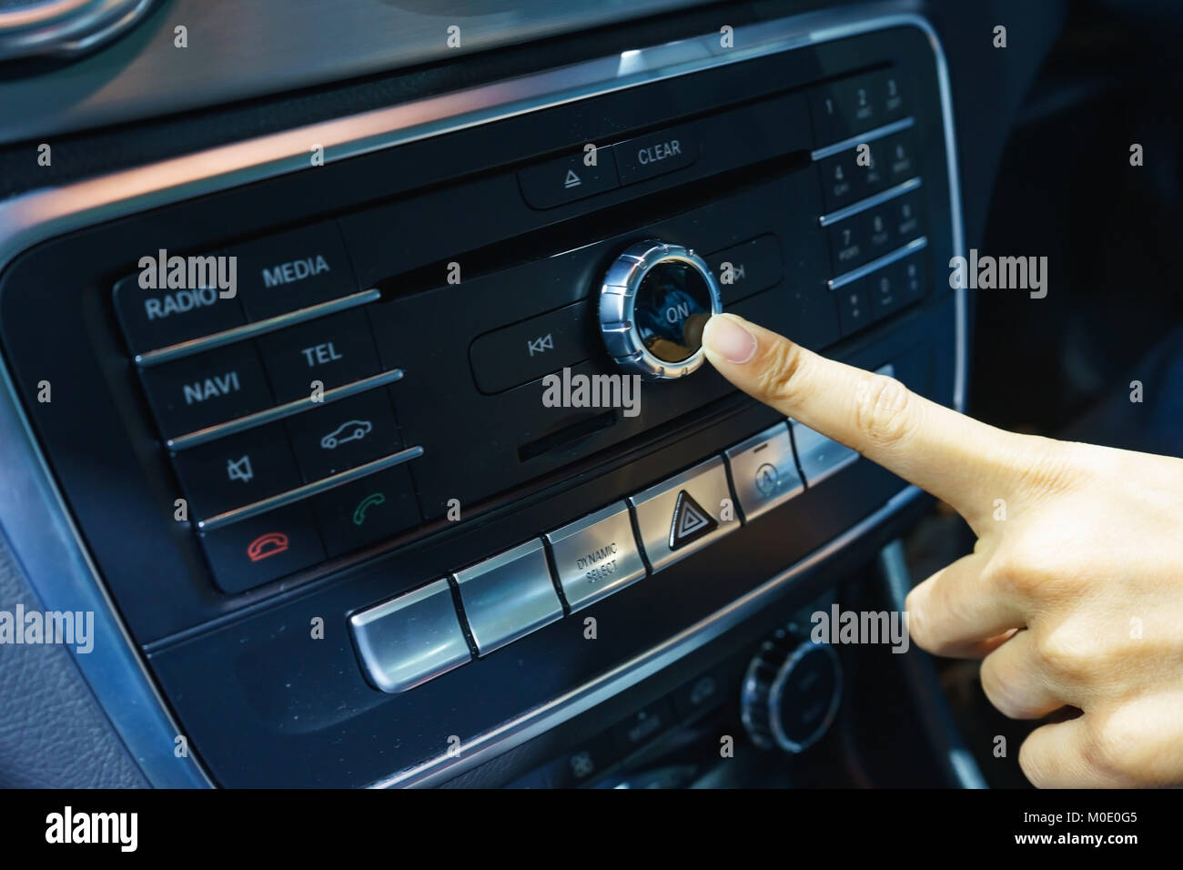 Close up photo of female driver pressing the power button on the car ...