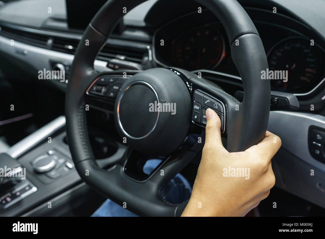 Driver's hands on the steering wheel inside of a car Stock Photo - Alamy