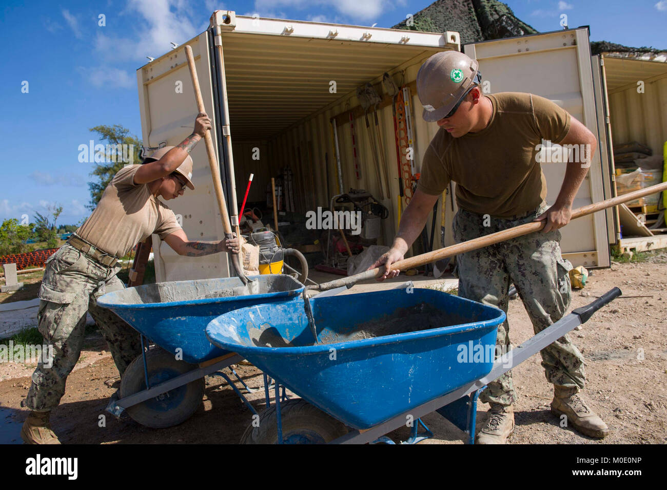 U.S. Navy Builder 2nd Class Juana Port (left) and Utilitiesman ...