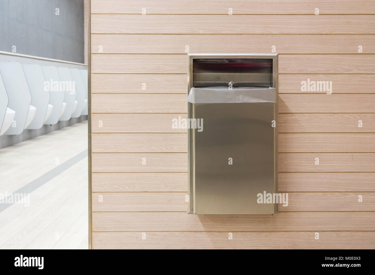 tissue paper and trash bin on wooden wall at public toilet Stock Photo ...