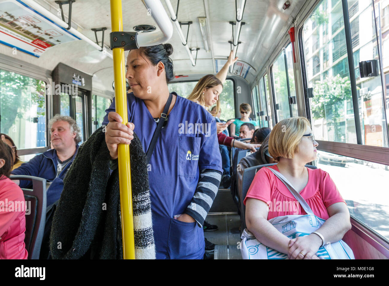Woman standing on bus hi-res stock photography and images - Alamy