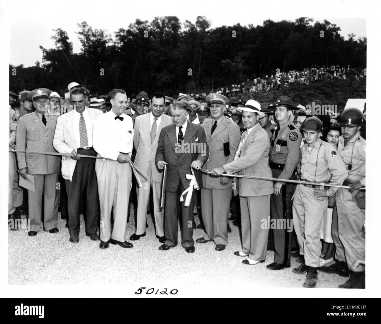 Vice President Alben W. Barkley cuts the ribbon to dedicate Wolf Creek ...