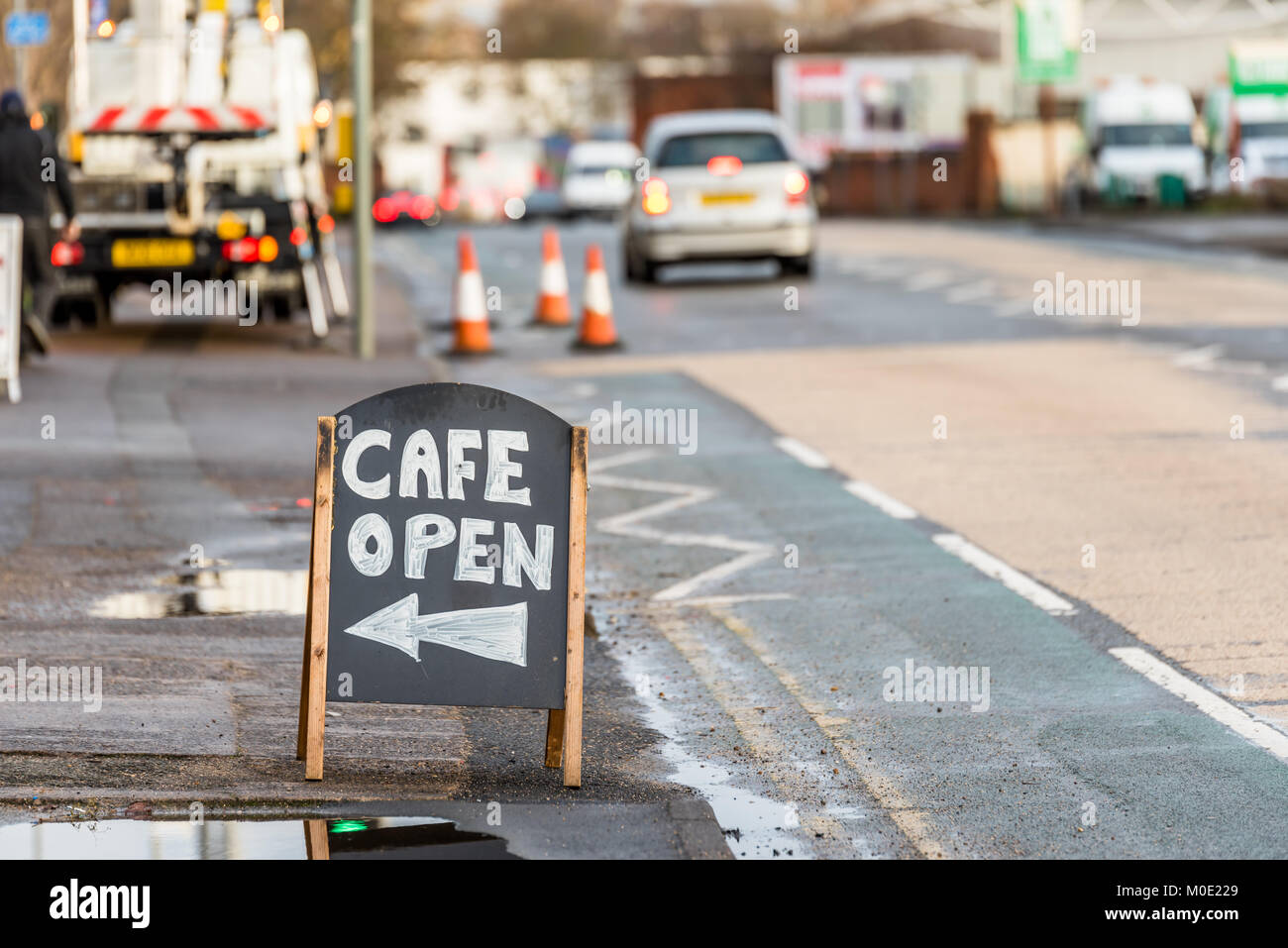 Day view Cafe Open wooden sign on sidewalk Stock Photo - Alamy