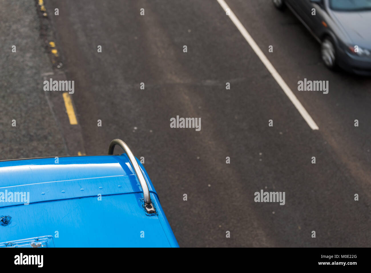Overhead view blue bus roof over traffic on UK motorway Stock Photo - Alamy