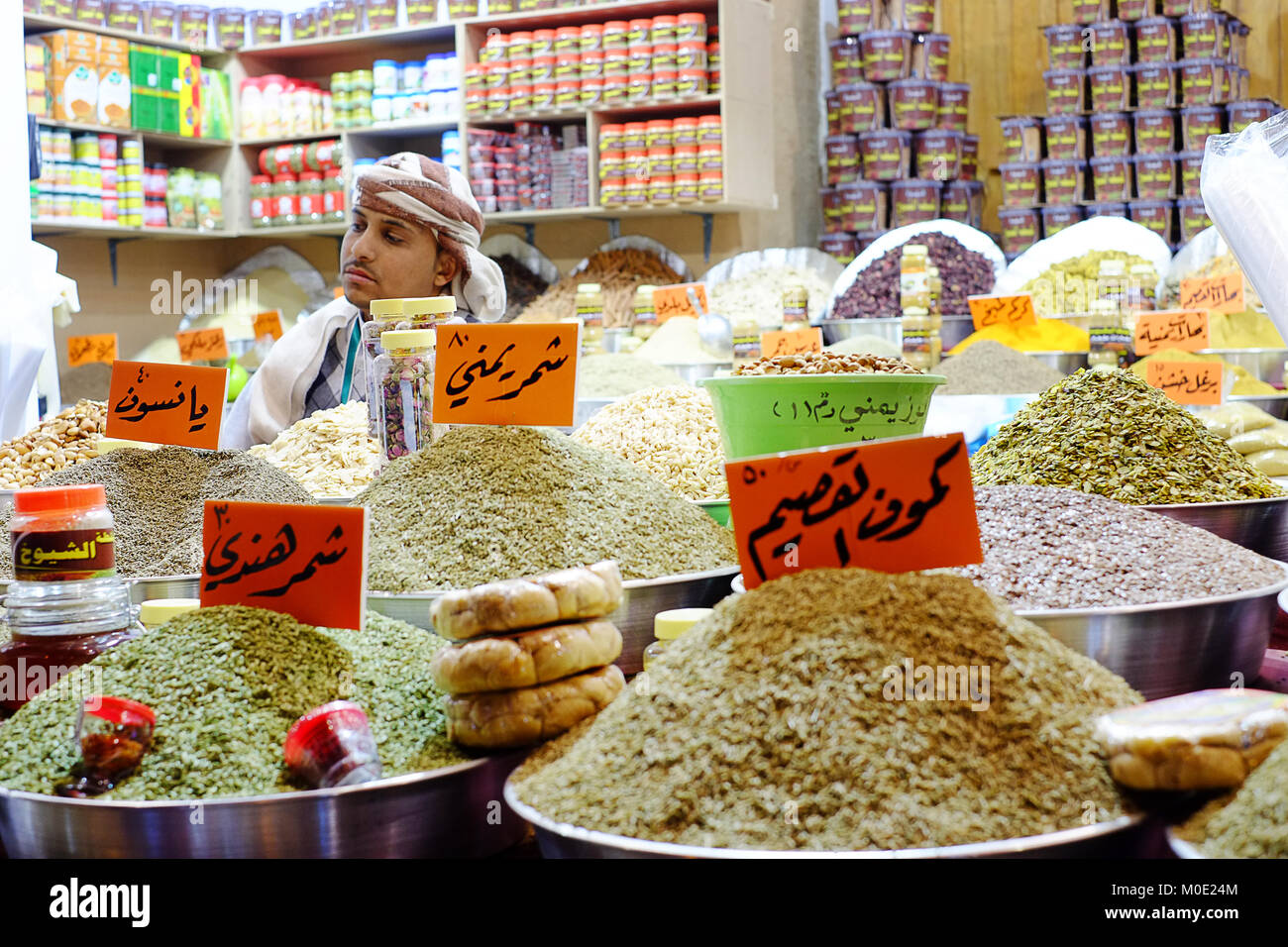 An Arab man sells different kinds of nuts on his small store Stock ...
