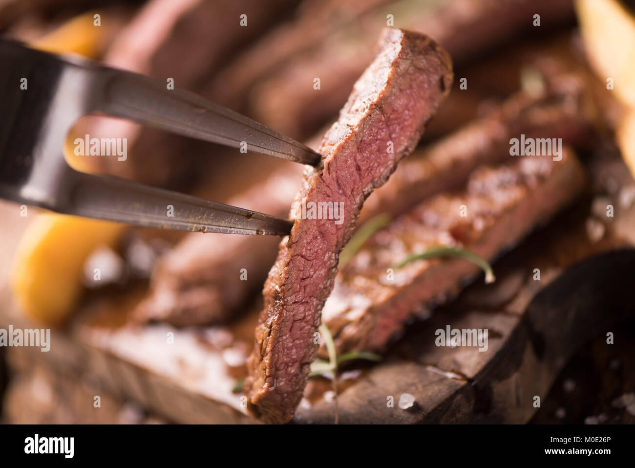 Closeup of a slice of beef steak Stock Photo - Alamy
