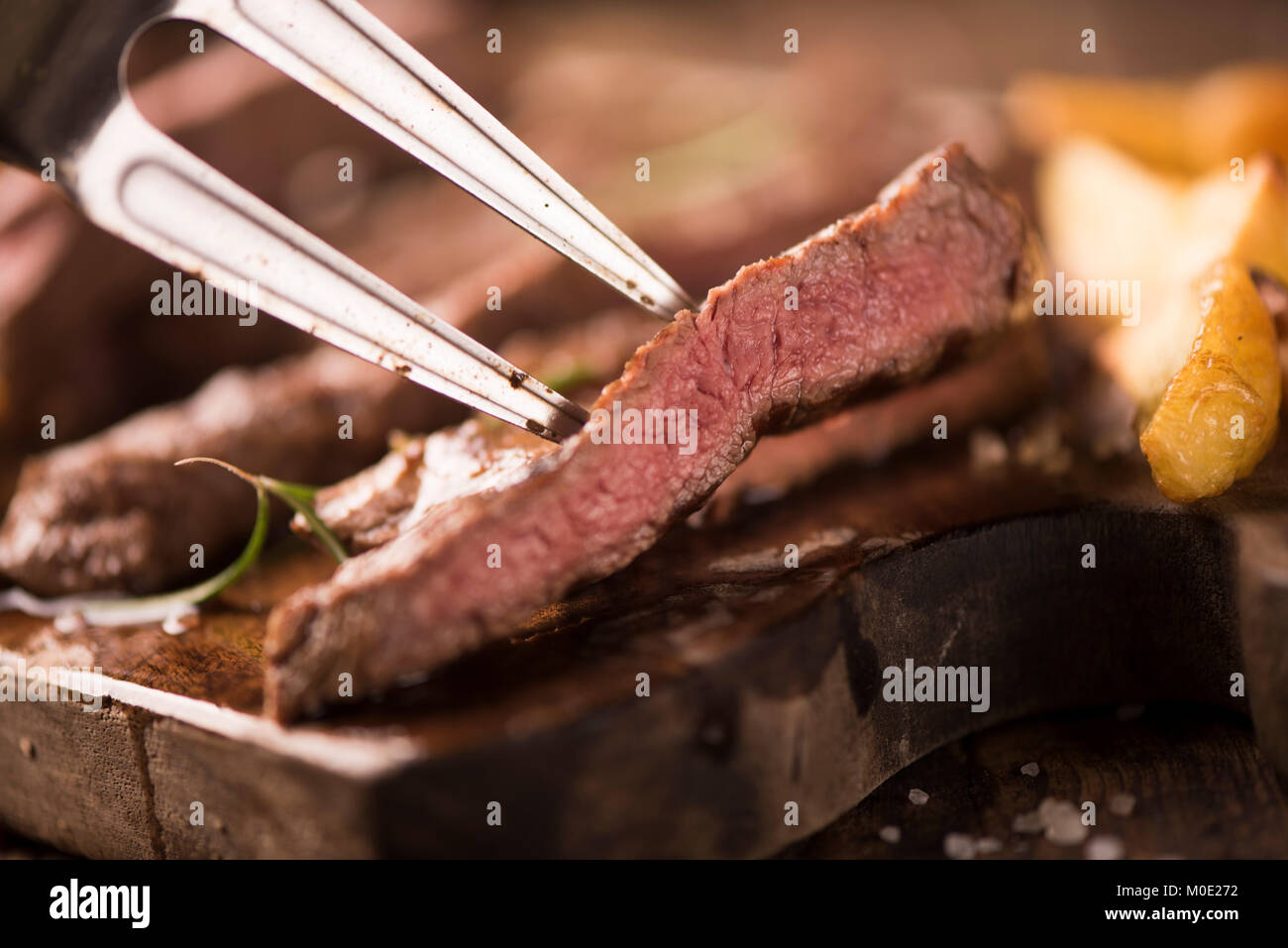 Closeup of a slice of beef steak Stock Photo - Alamy