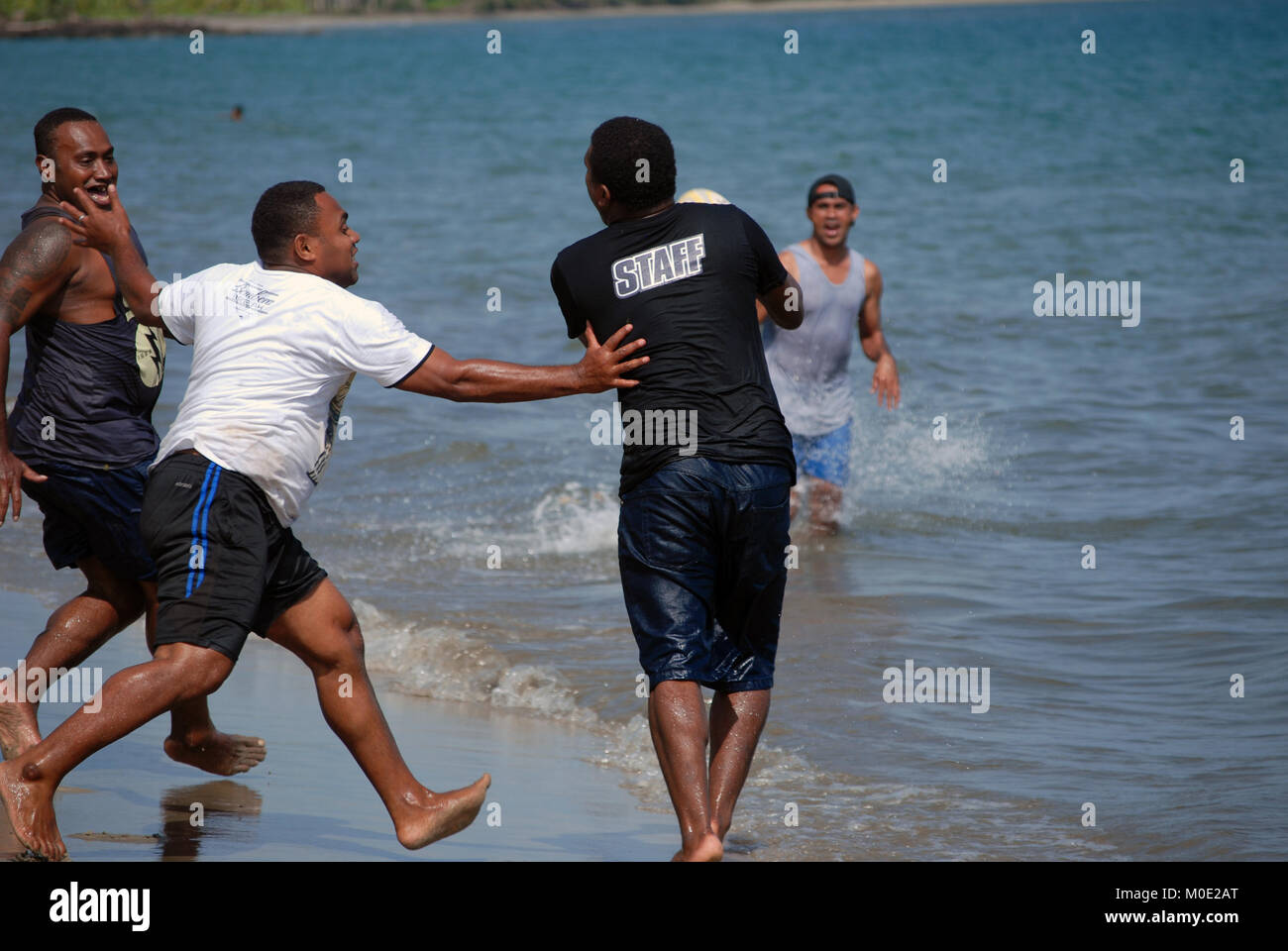 Fijian men playing rugby on Palm Beach, Pacific Harbour, Fiji Stock ...