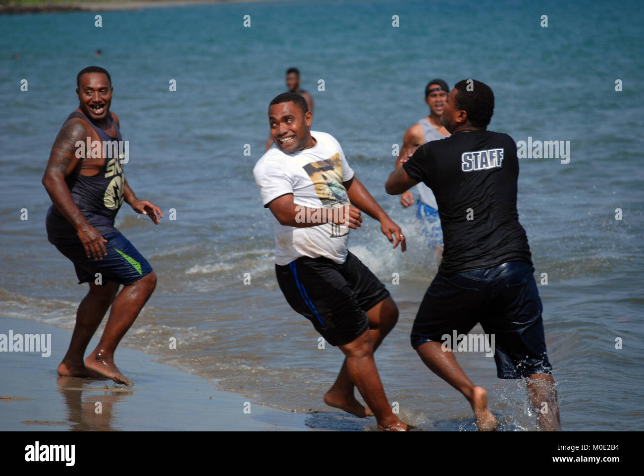 Fijian men playing rugby on Palm Beach, Pacific Harbour, Fiji Stock ...