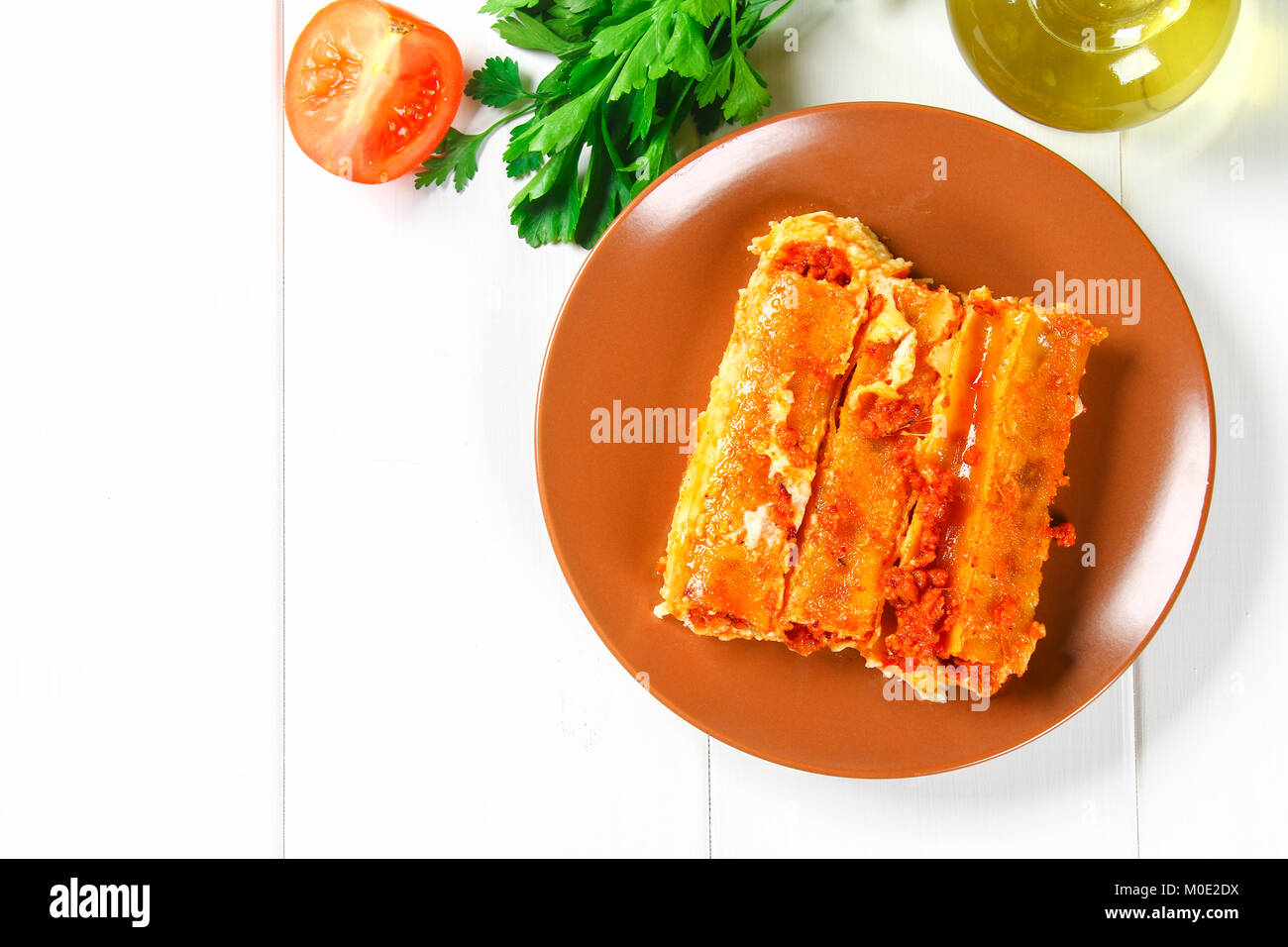 Traditional Italian pasta cannelloni. Baked tubes stuffed with minced ...