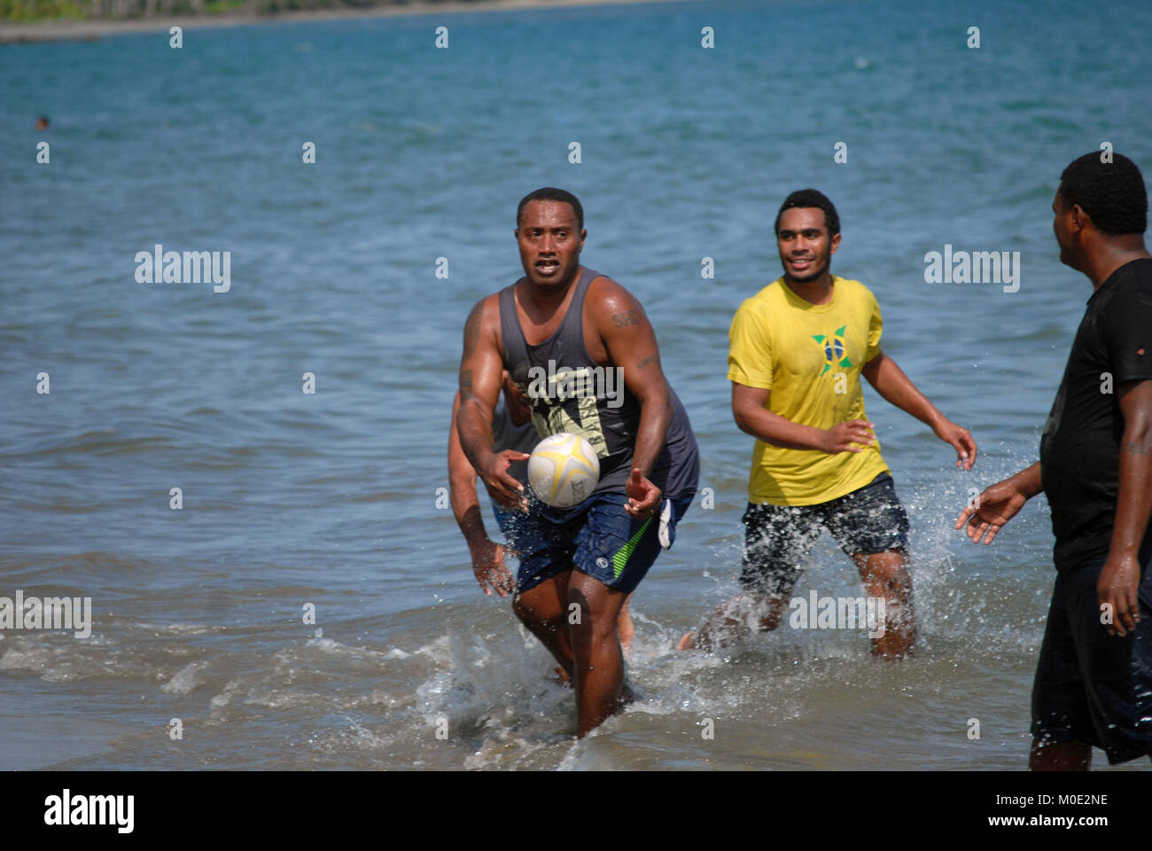 Fijian men playing rugby on Palm Beach, Pacific Harbour, Fiji Stock ...