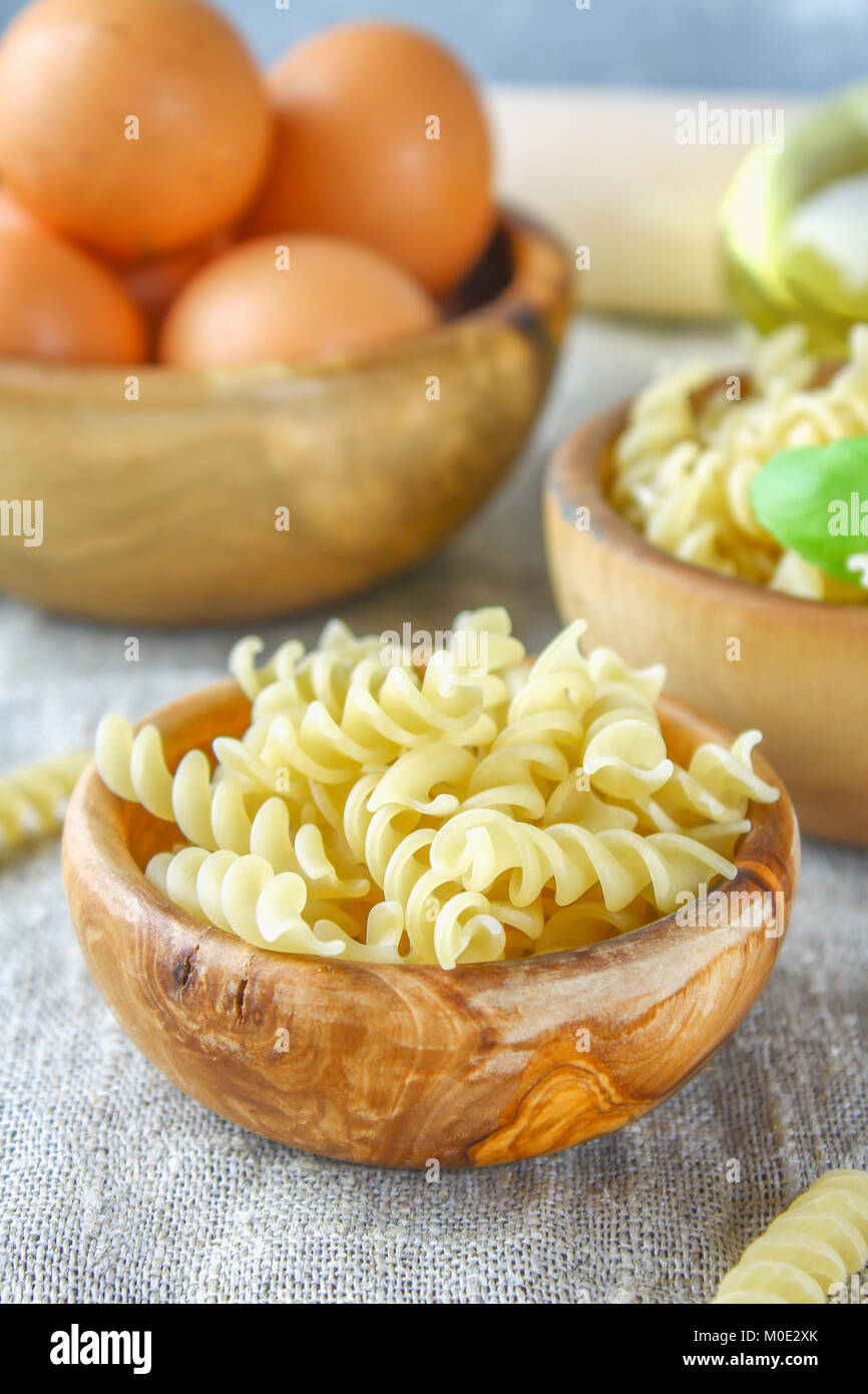 Helix- or corkscrew-shaped pasta. Rotini macaroni. Related to fusilli ...