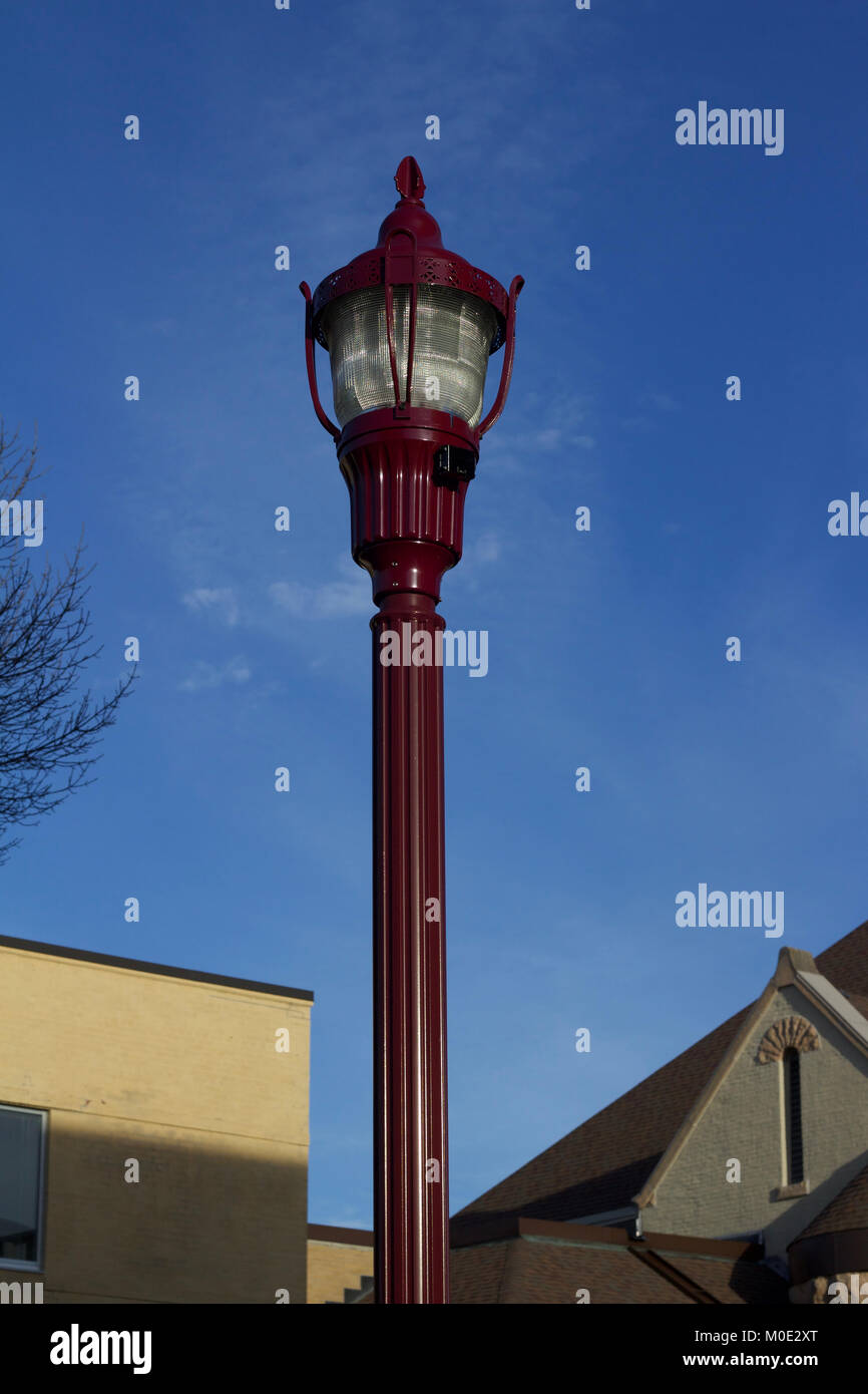 Upward view of Red city street lamp with blue sky background in fall ...