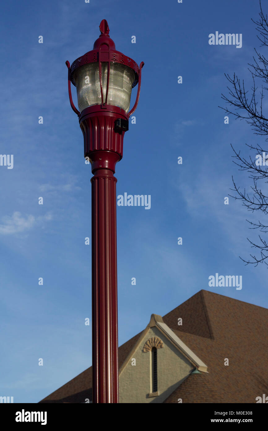 Upward view of Red city street lamp with blue sky background in fall ...