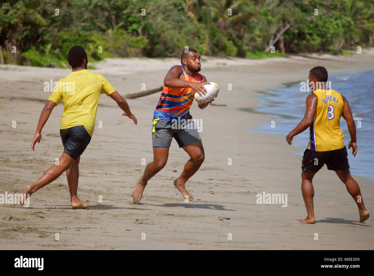 Fijian men playing rugby on Palm Beach, Pacific Harbour, Fiji Stock ...