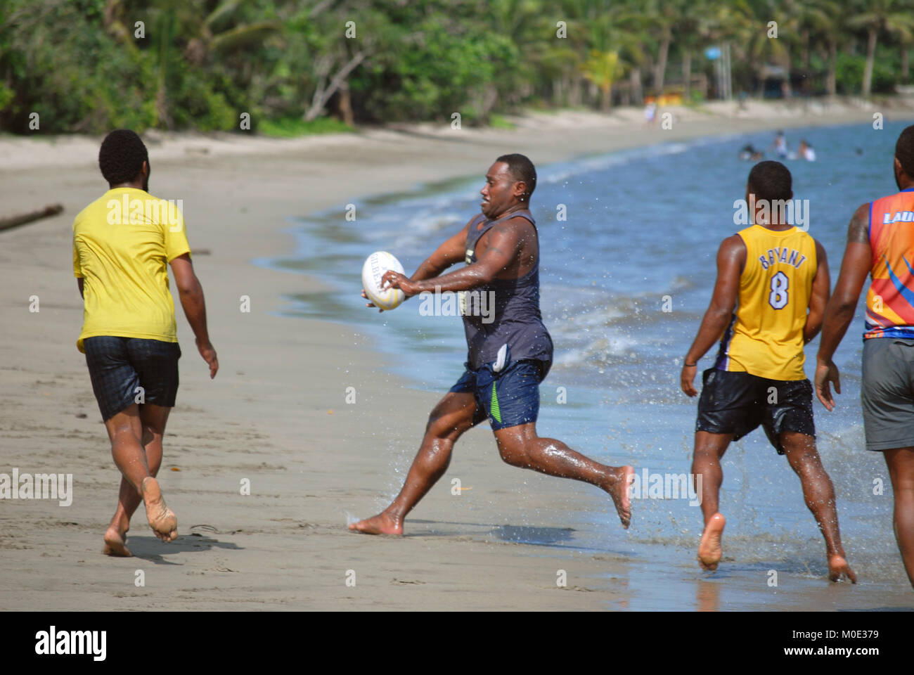 Fijian men playing rugby on Palm Beach, Pacific Harbour, Fiji Stock ...