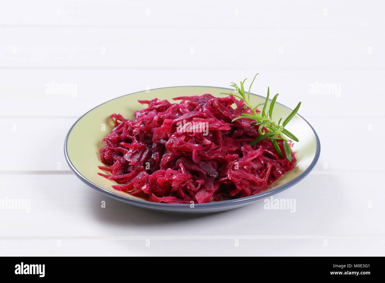 plate of pickled red cabbage on white wooden background Stock Photo - Alamy