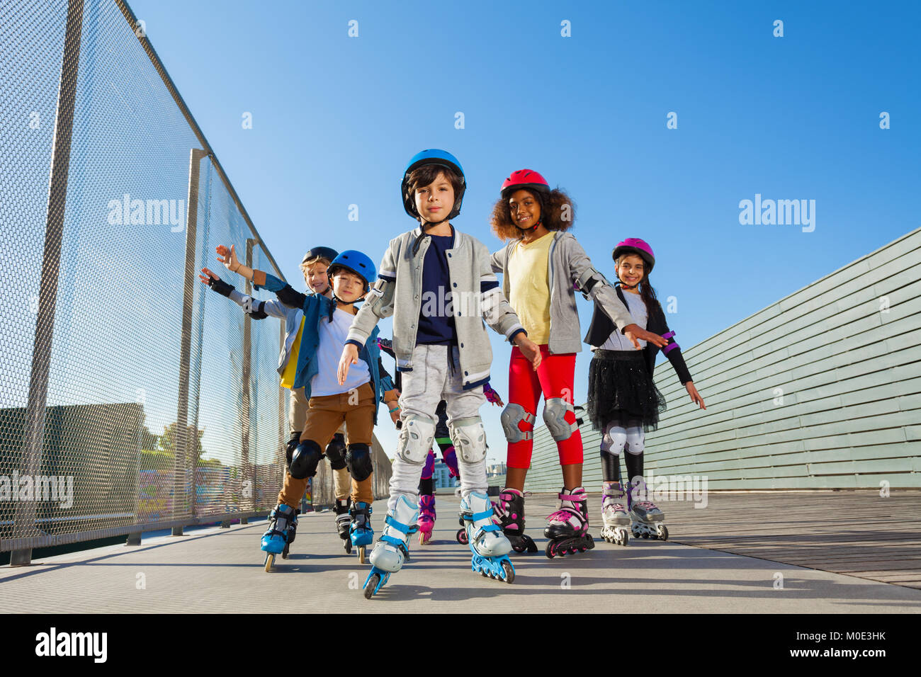 Preteen kids rollerblading outdoors at stadium Stock Photo - Alamy