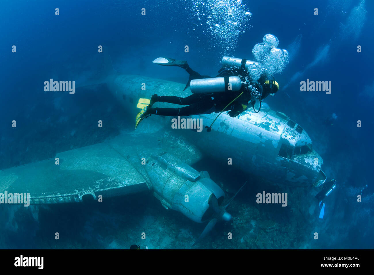 Scuba diver at Douglas C-47, Dakota, military version of the DC-3 ...