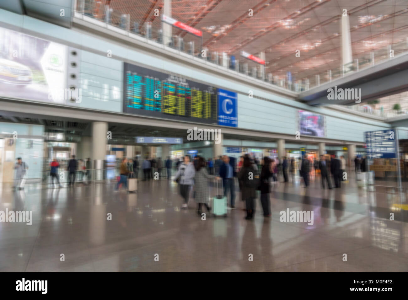 Airport departure gate with passengers walking - blurred abstract photo ...