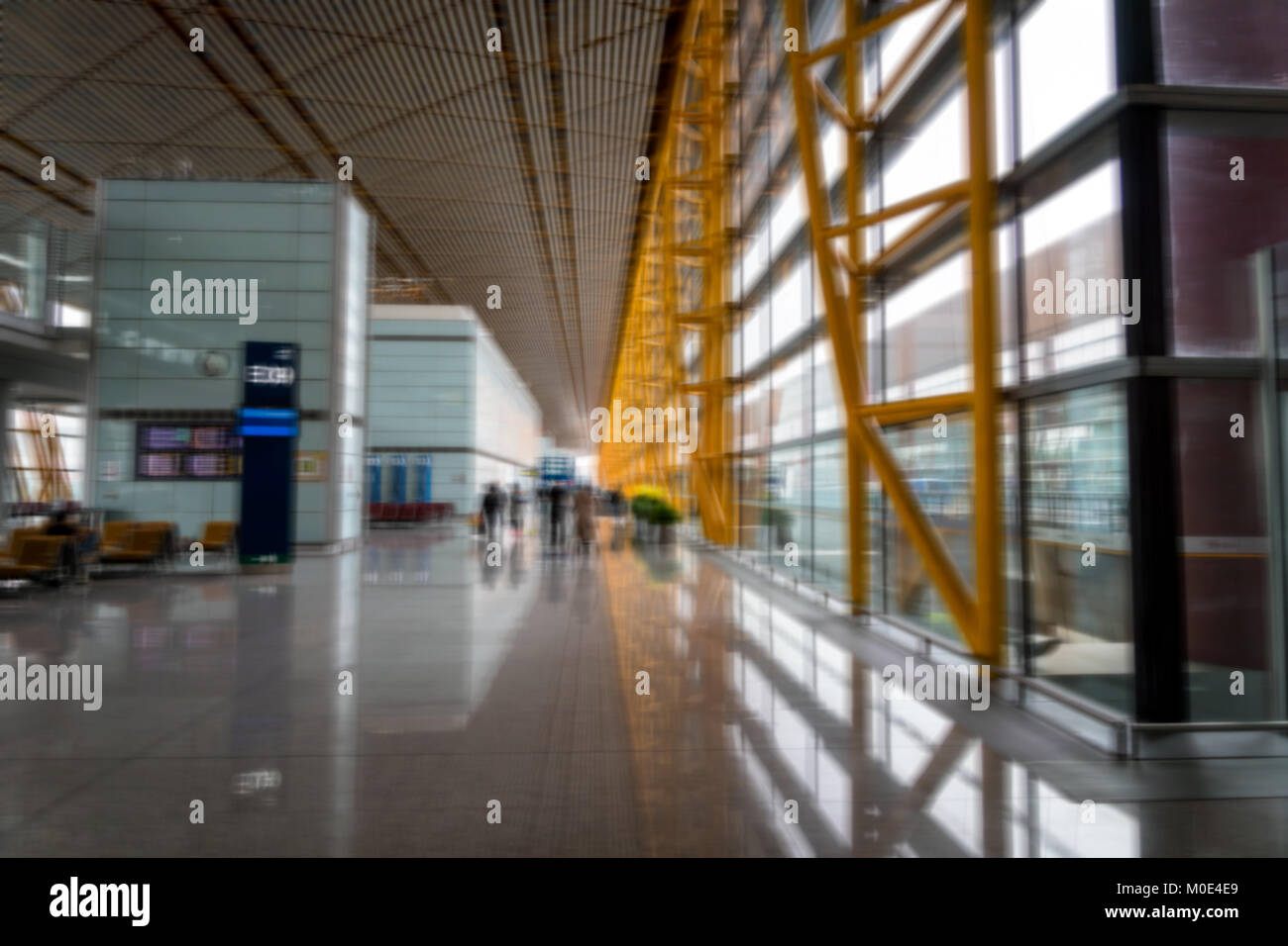 Airport departure gate with passengers walking - blurred abstract photo ...