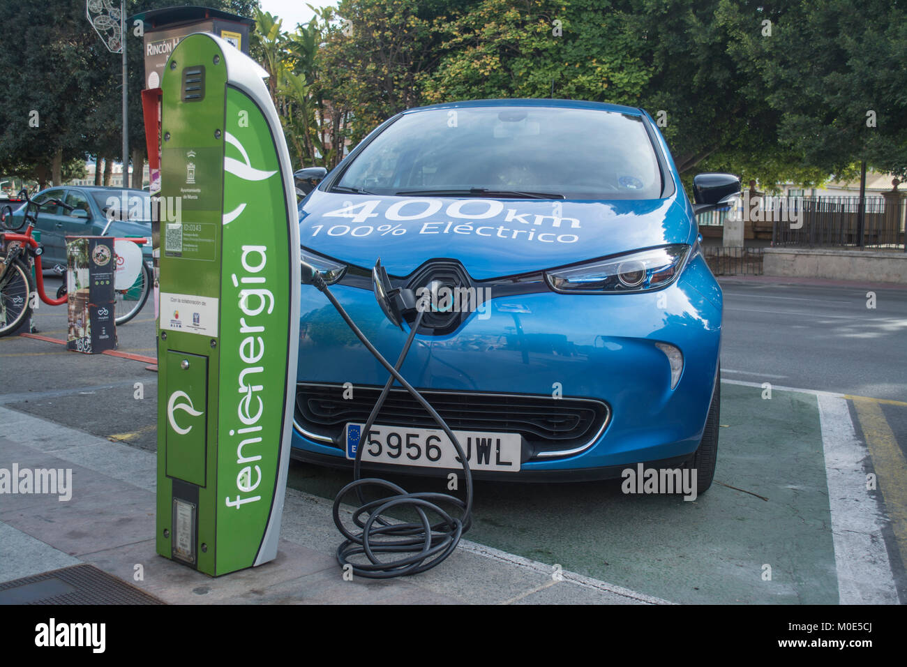 Electric car pluged in to it's charging point in Murcia Spain Stock ...
