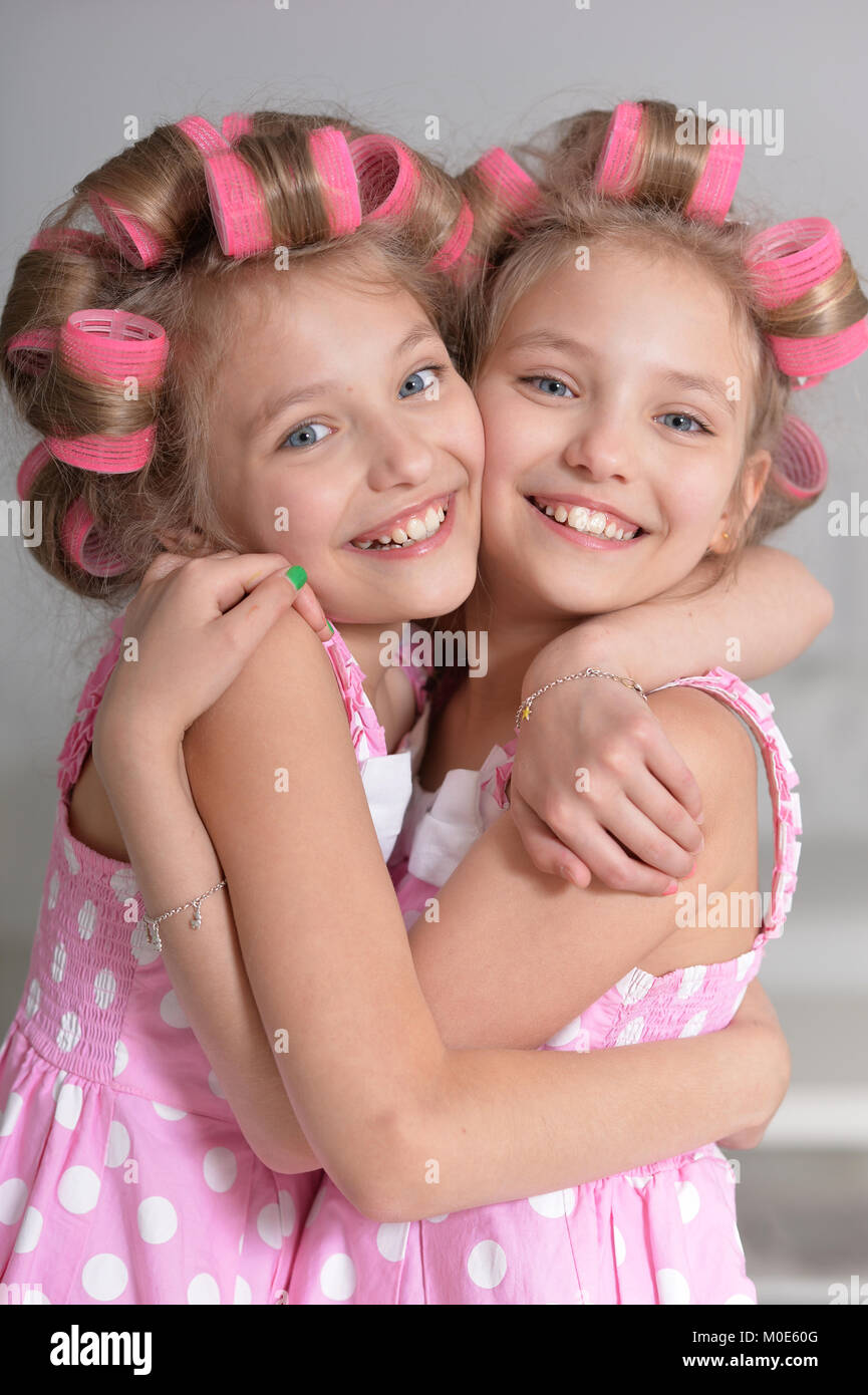Twin sisters hugging hi-res stock photography and images - Alamy