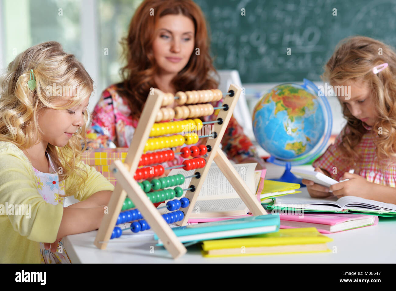 Girls classroom books hi-res stock photography and images - Alamy